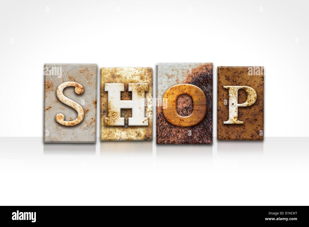 The word "SHOP" written in rusty metal letterpress type isolated on a ...