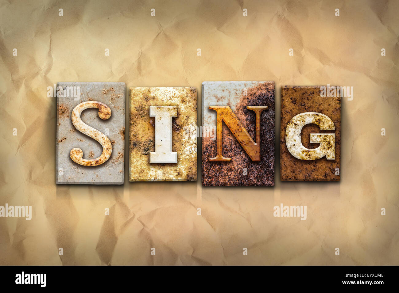The word "SING" written in rusty metal letterpress type on a crumbled ...