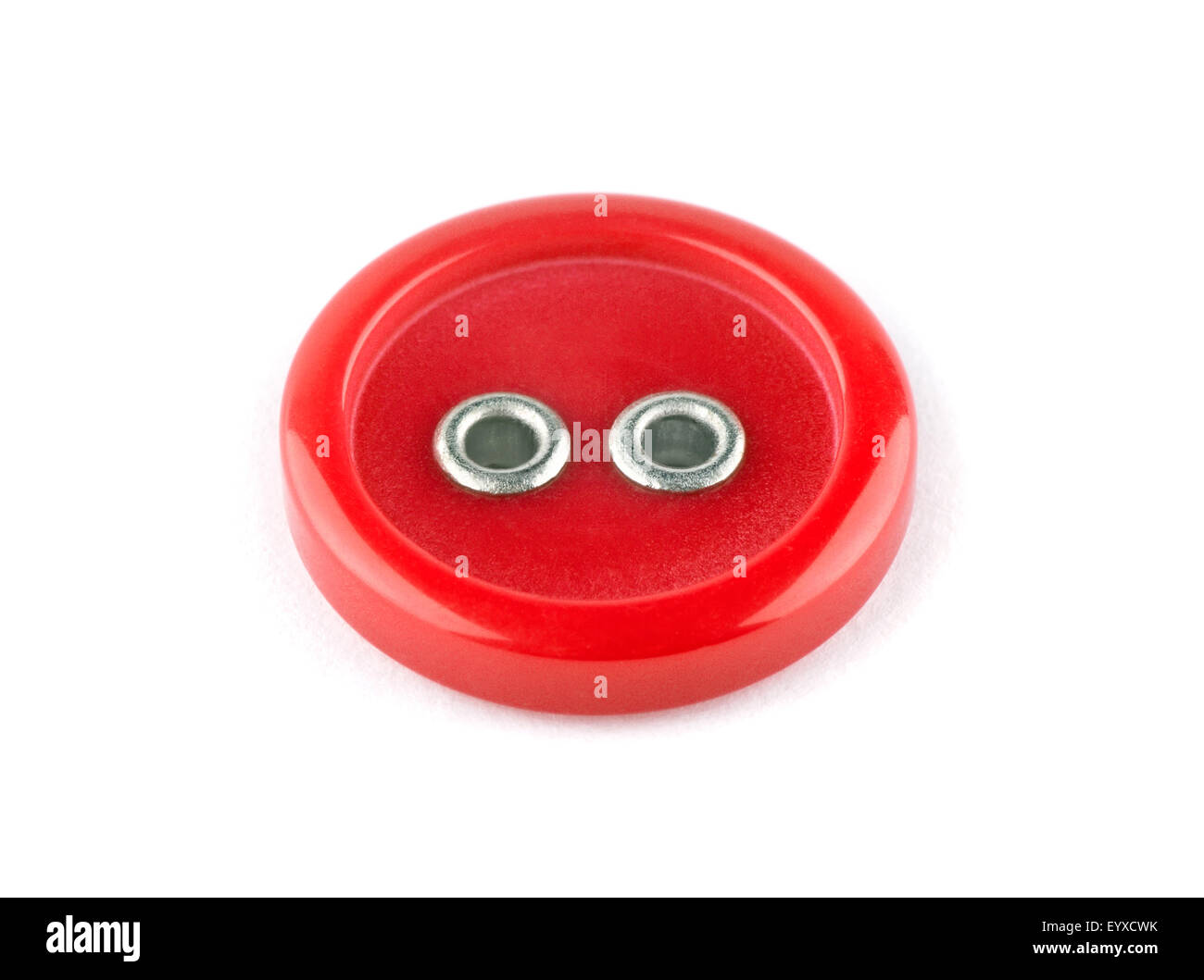 Red sewing button on white background Stock Photo - Alamy