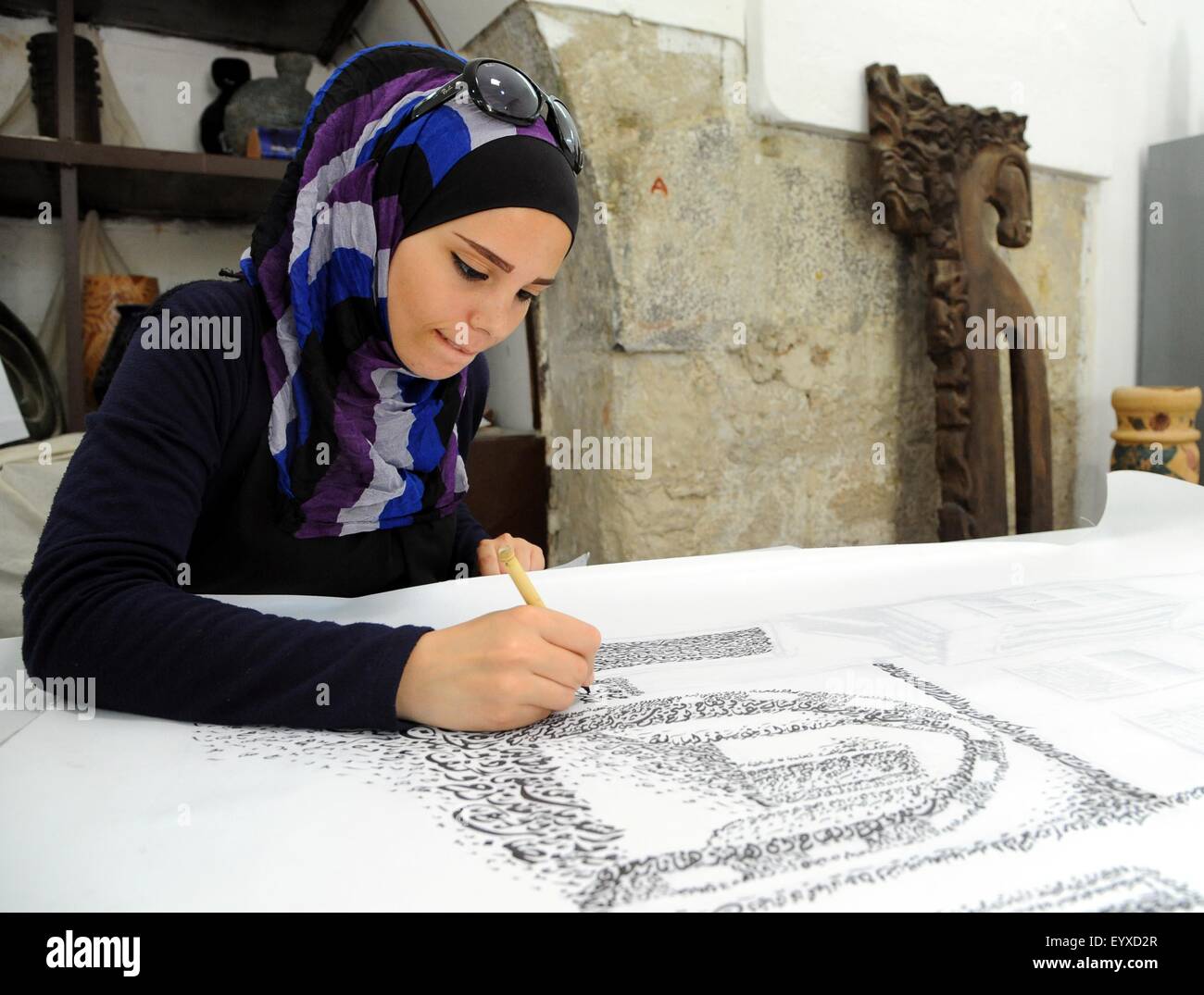 Damascus, Syria. 4th Aug, 2015. A Syrian girl takes part in a drawing ...