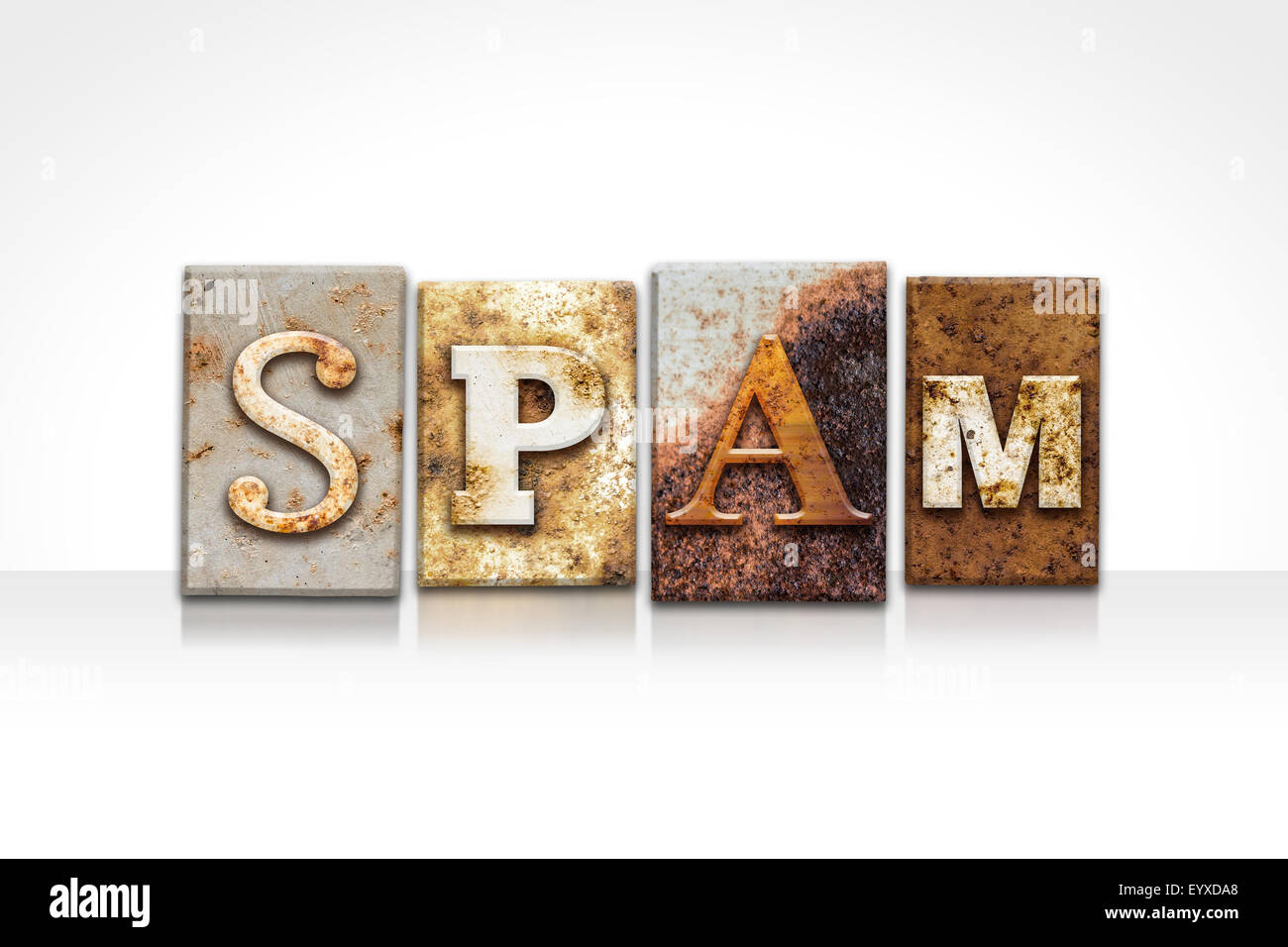 The word "SPAM" written in rusty metal letterpress type isolated on a ...