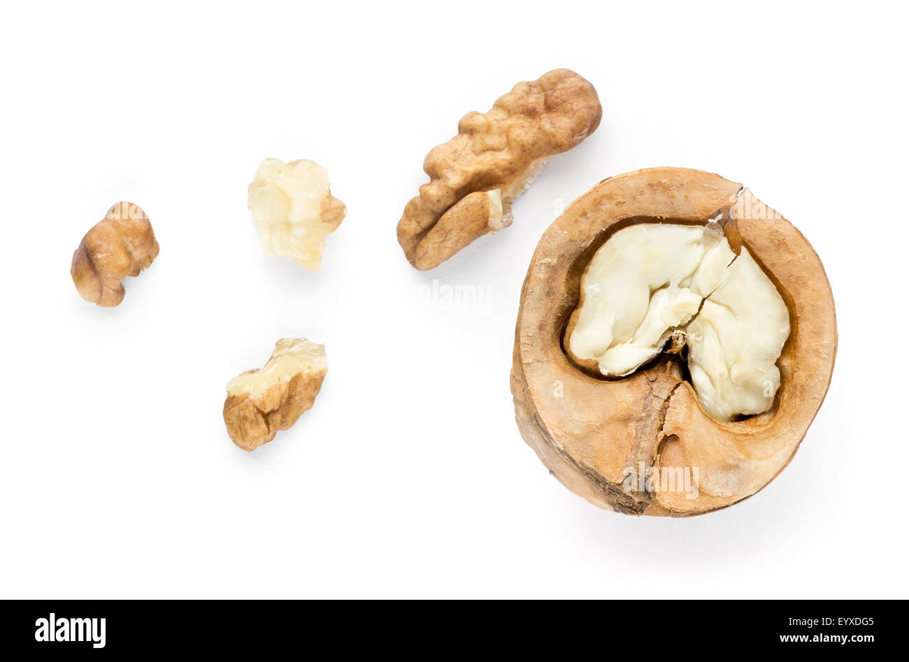 Cracked walnut on white background Stock Photo - Alamy