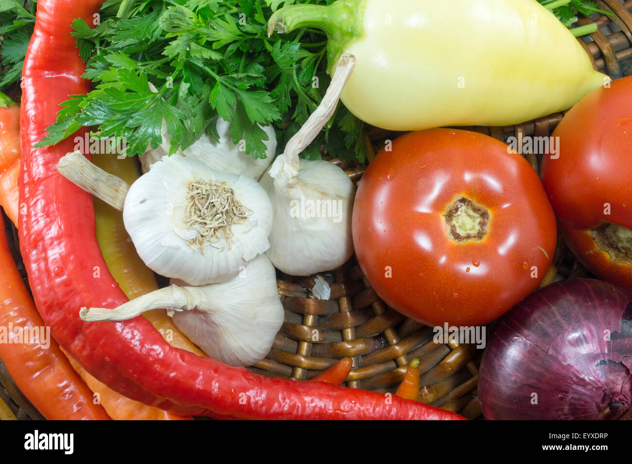 Colorful fresh natural vegetables and spices on the wooden plate ready ...