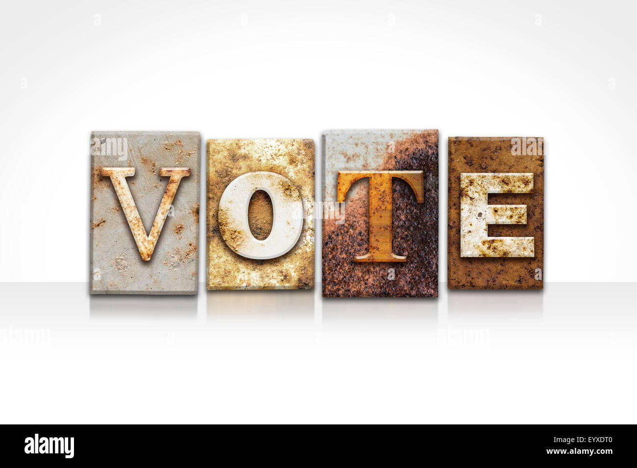 The word "VOTE" written in rusty metal letterpress type isolated on a ...