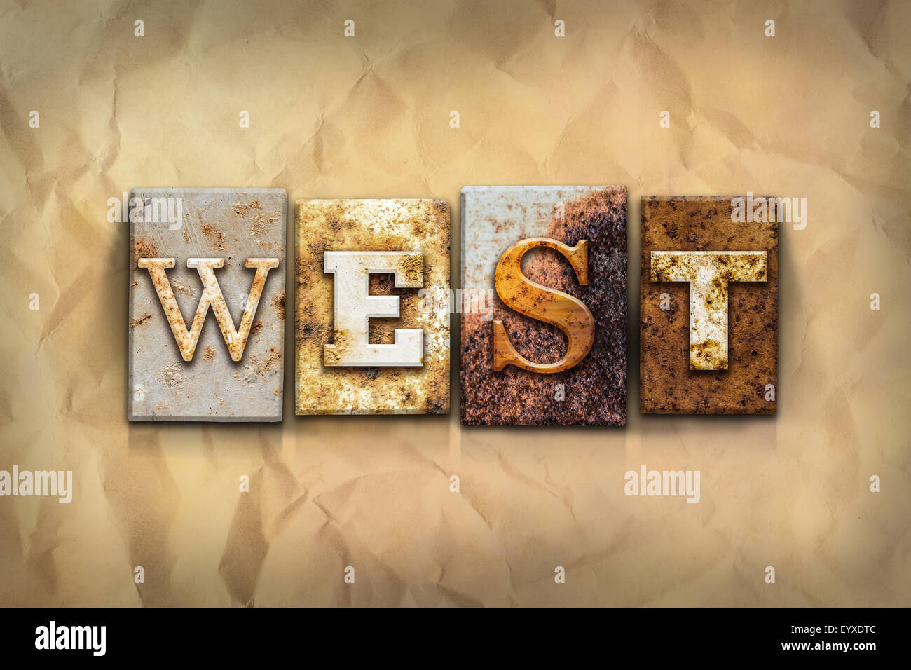 The word "WEST" written in rusty metal letterpress type on a crumbled ...