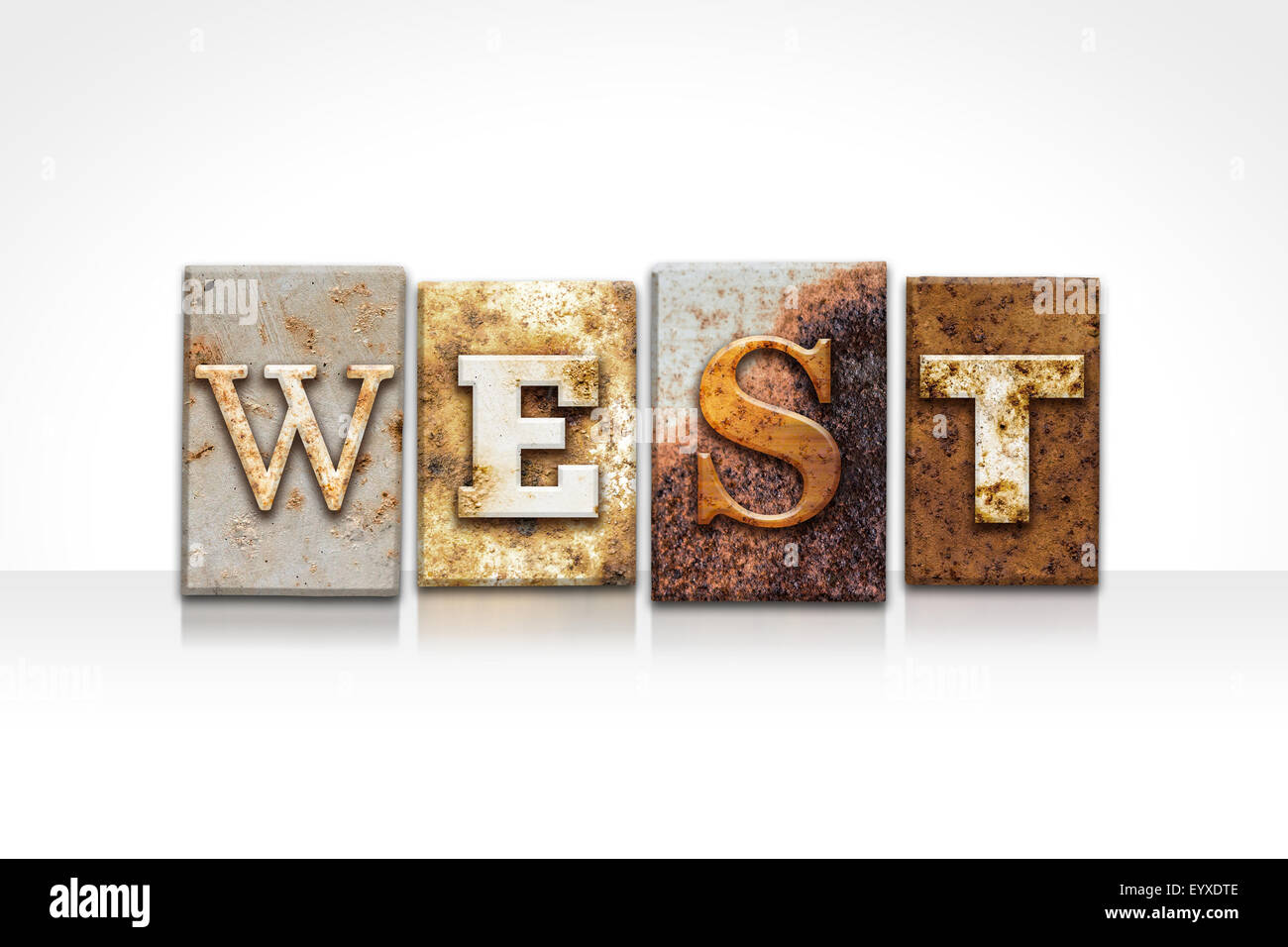 The word "WEST" written in rusty metal letterpress type isolated on a ...