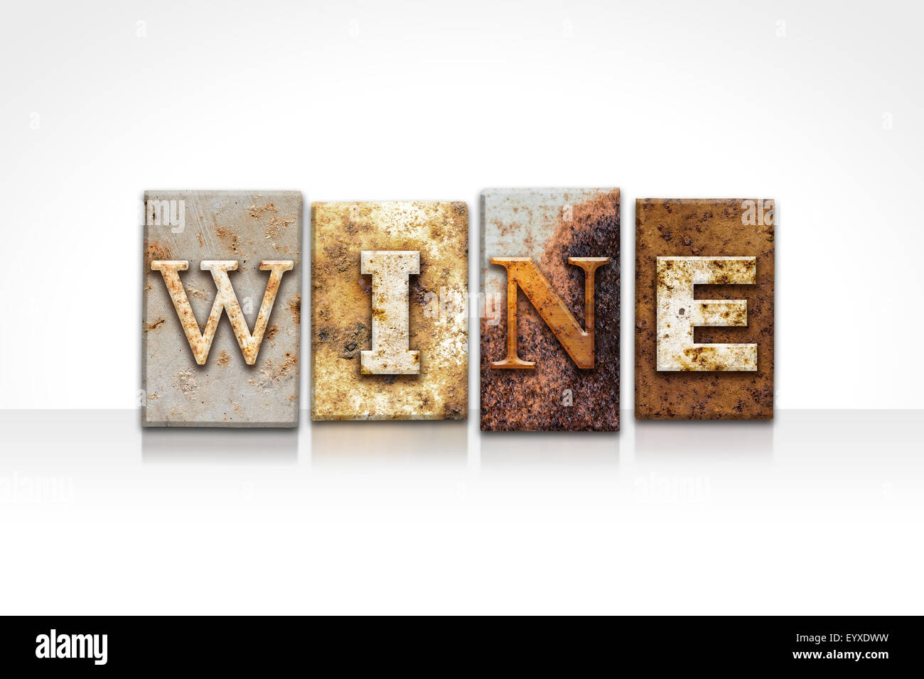 The word "WINE" written in rusty metal letterpress type isolated on a ...