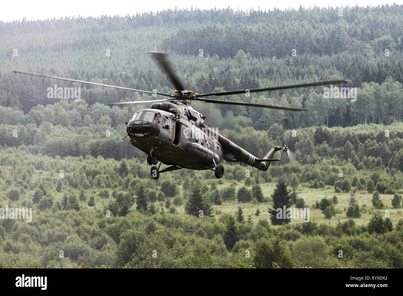 Military helicopter flying over forest hi-res stock photography and ...