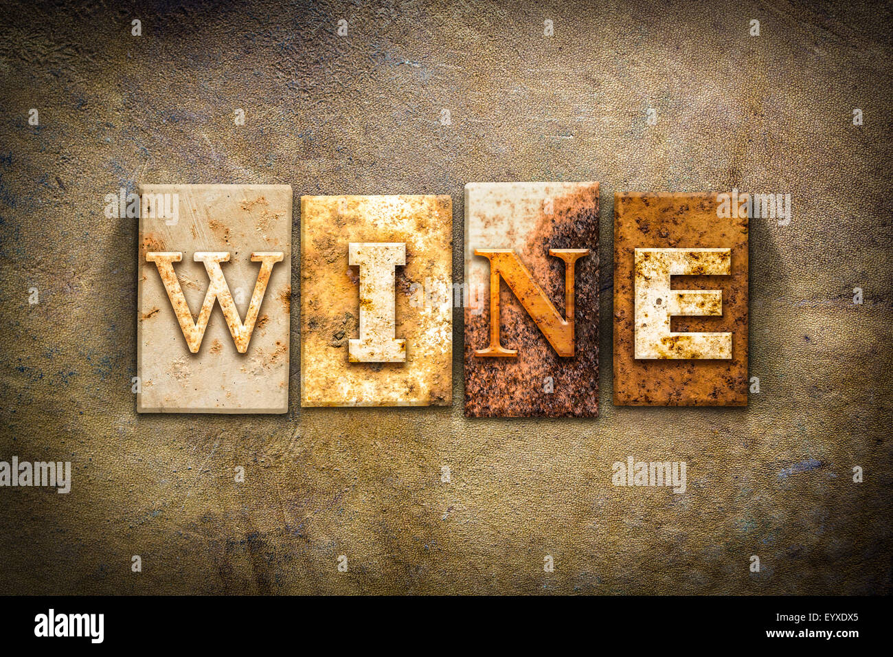 The word "WINE" written in rusty metal letterpress type on an old aged ...