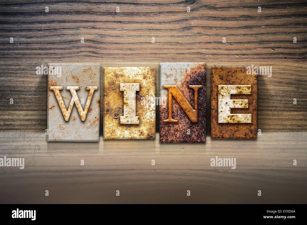 The word "WINE" written in rusty metal letterpress type sitting on a ...