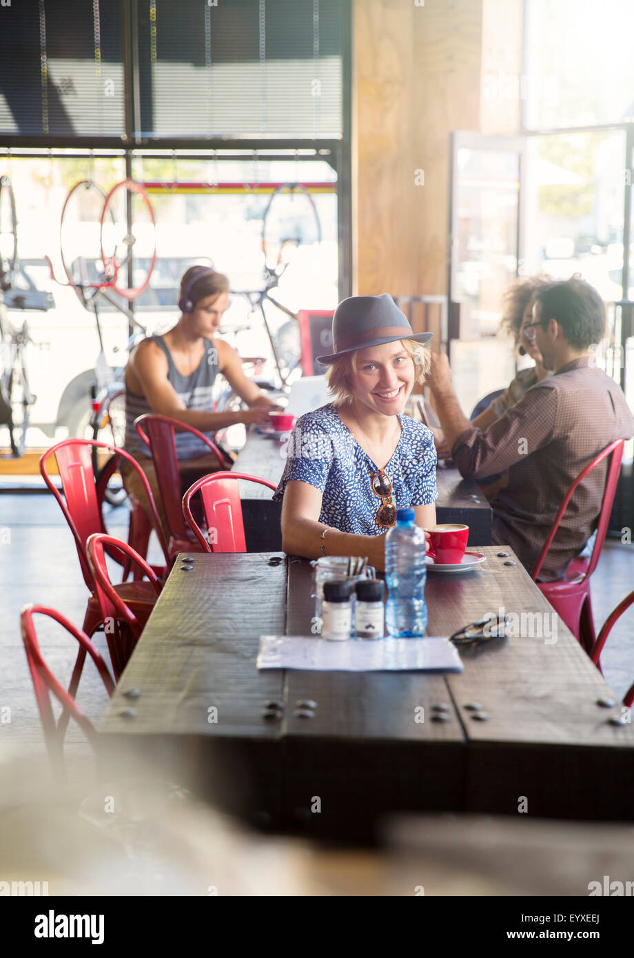 Portrait smiling woman drinking coffee in cafe Stock Photo - Alamy