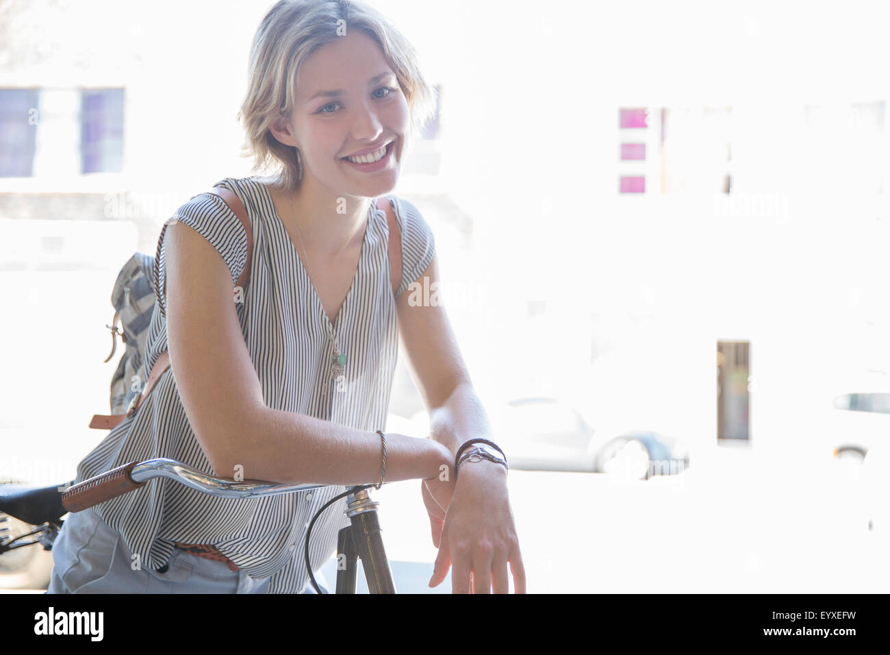 Woman bicycle standing on hi-res stock photography and images - Alamy