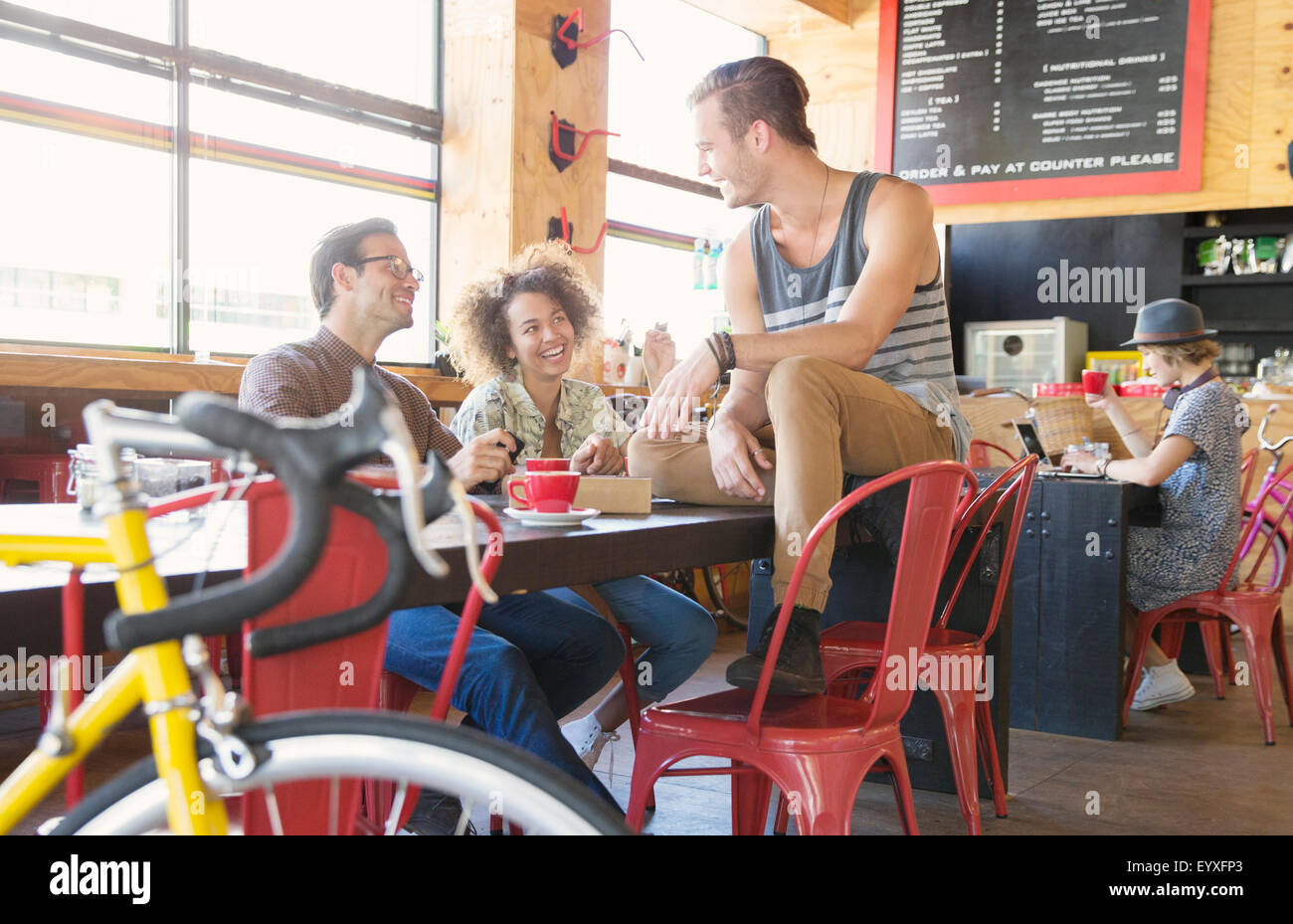 Friends hanging out talking in cafe Stock Photo - Alamy