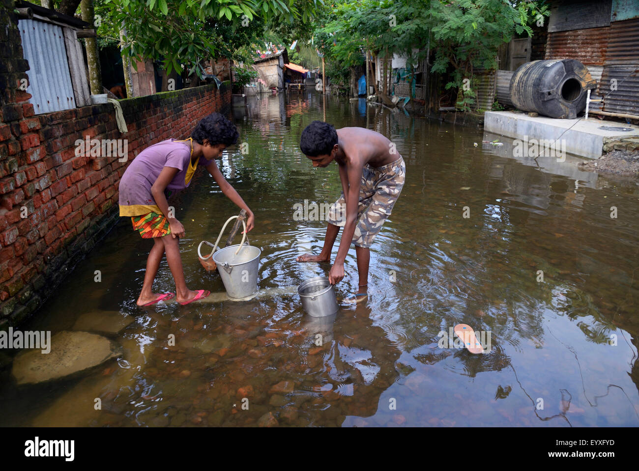 Kolkata, India. 04th Aug, 2015. Children fetching water. Rain stopped ...