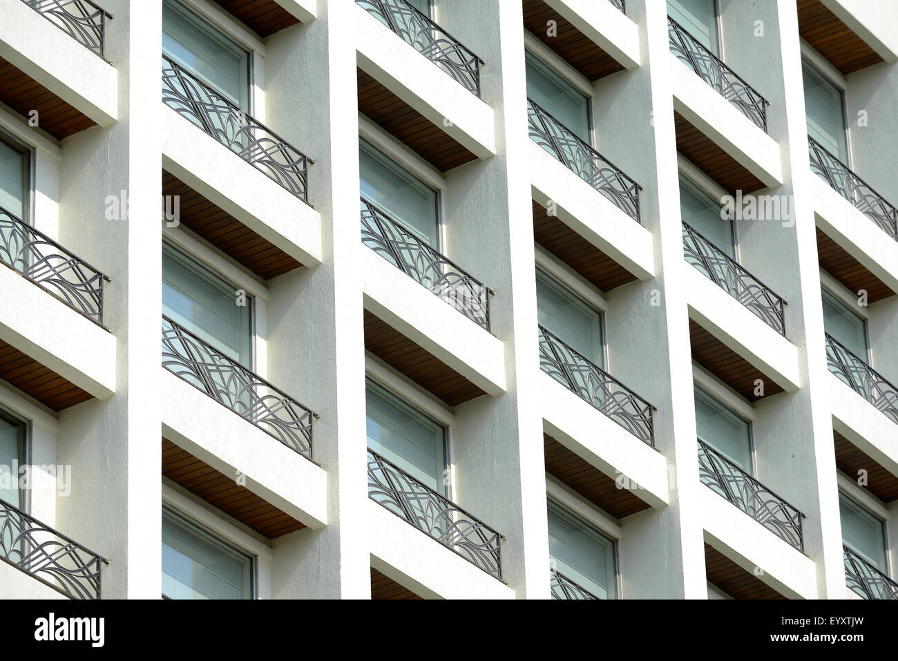 Close up of a Modern Building With Glass Windows and Metal Railing ...