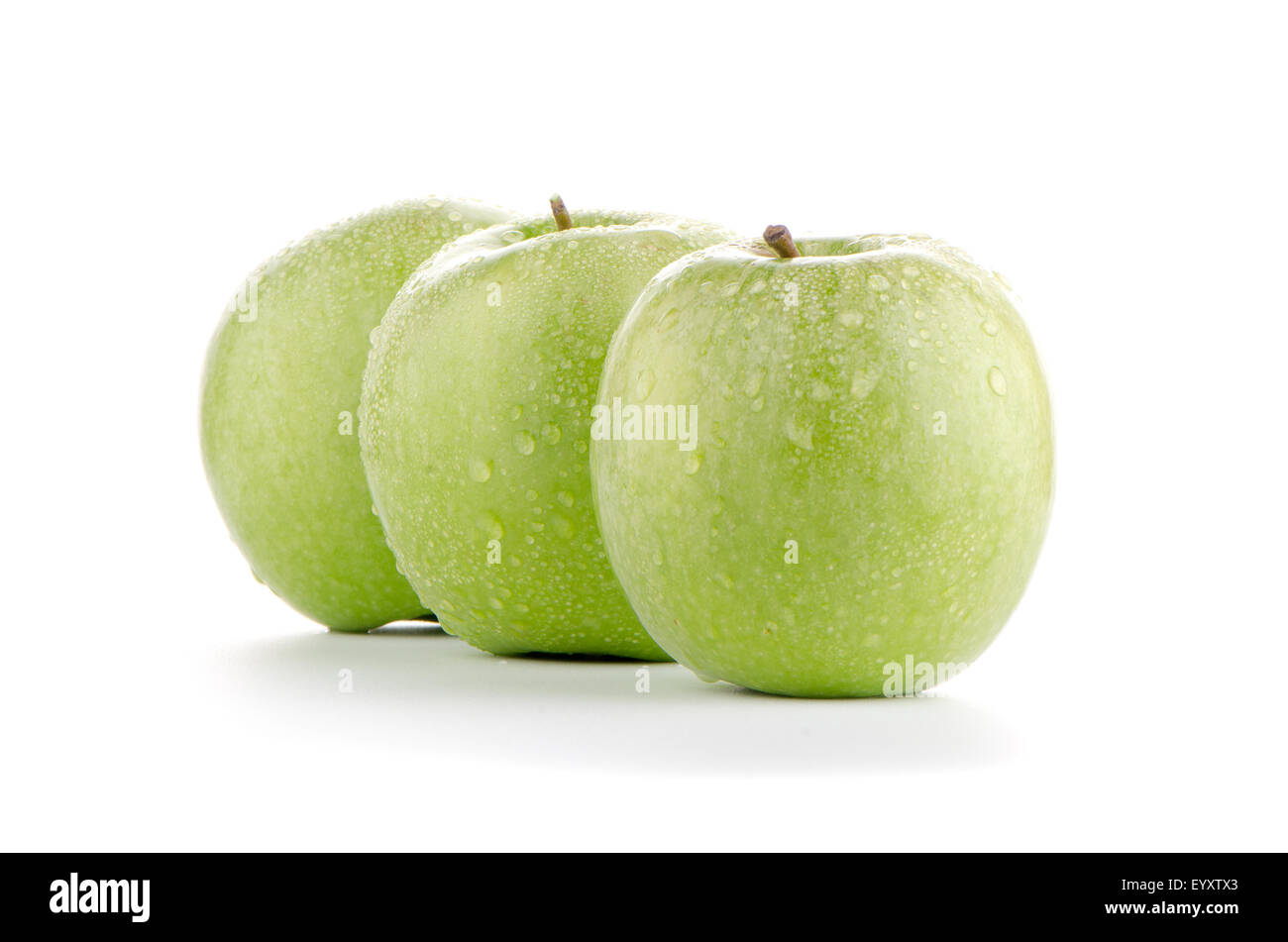 Three fresh green apples on white background Stock Photo - Alamy