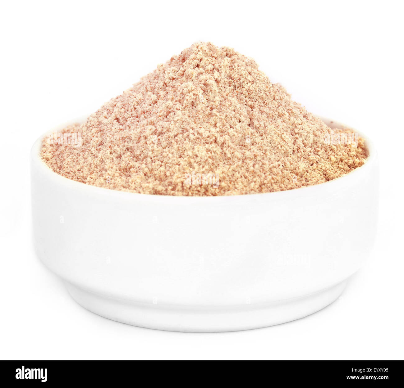 Fresh brown flour in a bowl over white background Stock Photo - Alamy