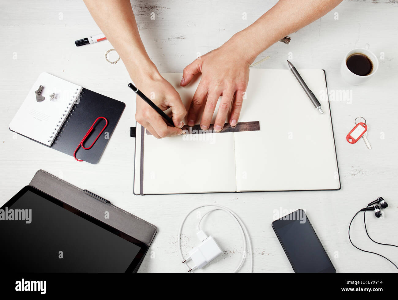 Workplace. Top view. Man working with modern devices and writing on ...