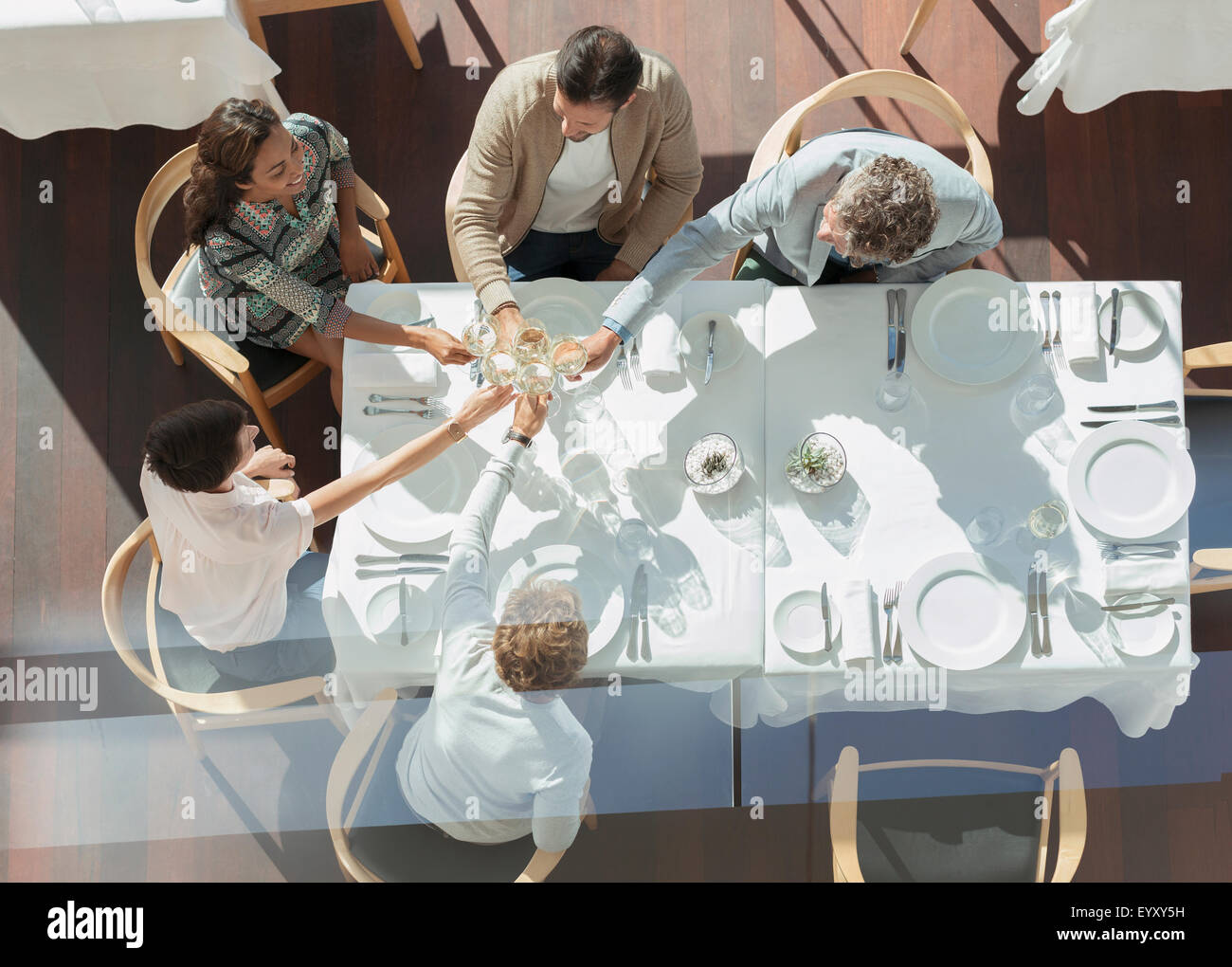 Group asian people toasting table hi-res stock photography and images ...