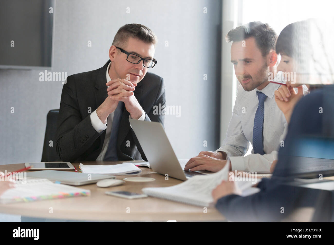 Business people working at laptop in conference room meeting Stock ...