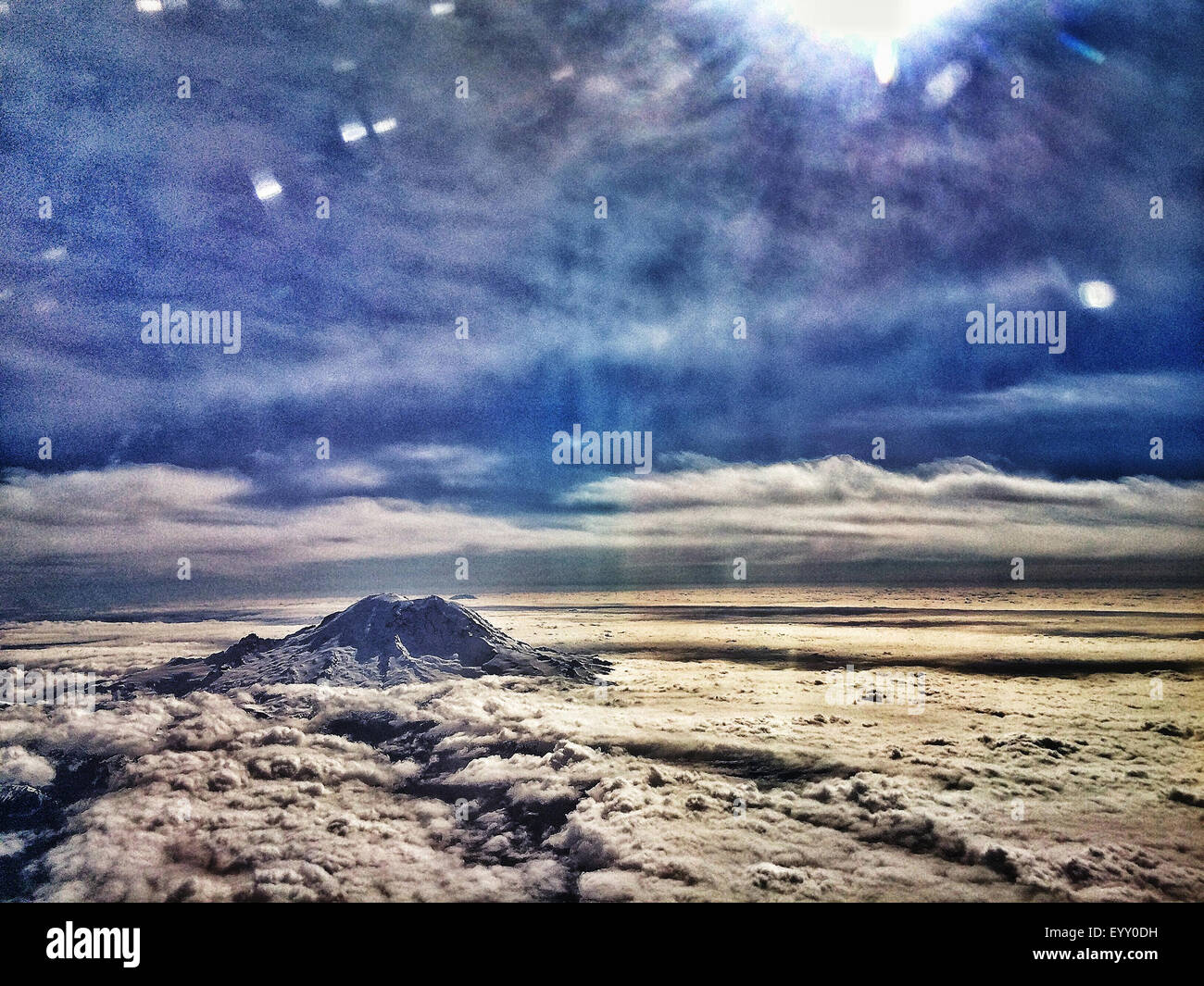 Mount Rainier mountaintop over cloudy sky, Seattle, Washington, United ...