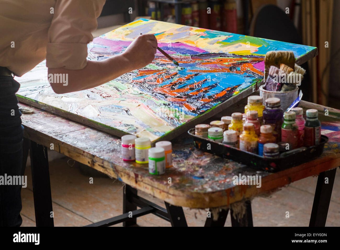 Mari artist painting canvas in studio Stock Photo - Alamy