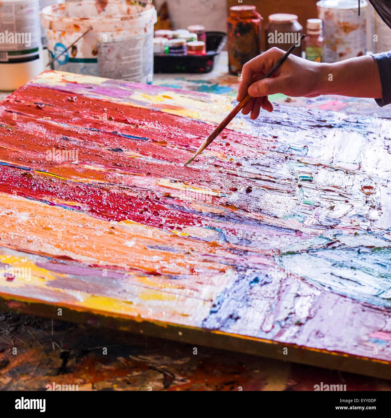 Mari artist painting canvas in studio Stock Photo - Alamy