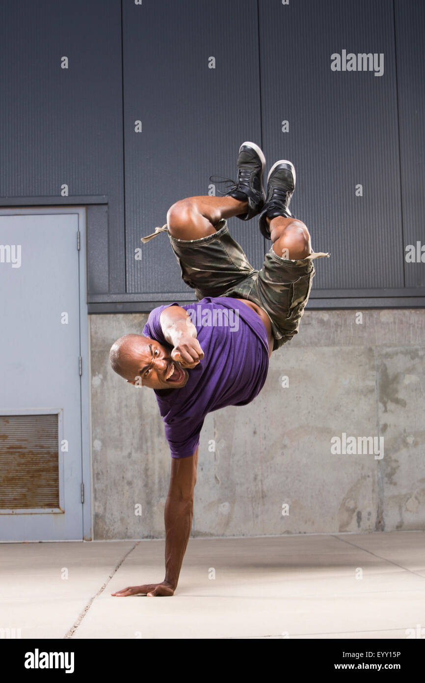 Black dancer balancing on hand Stock Photo - Alamy