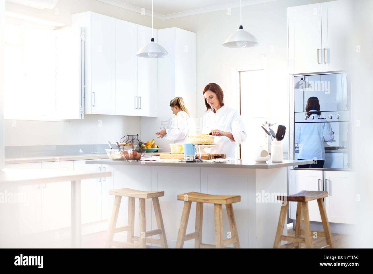 Chefs baking in kitchen Stock Photo - Alamy