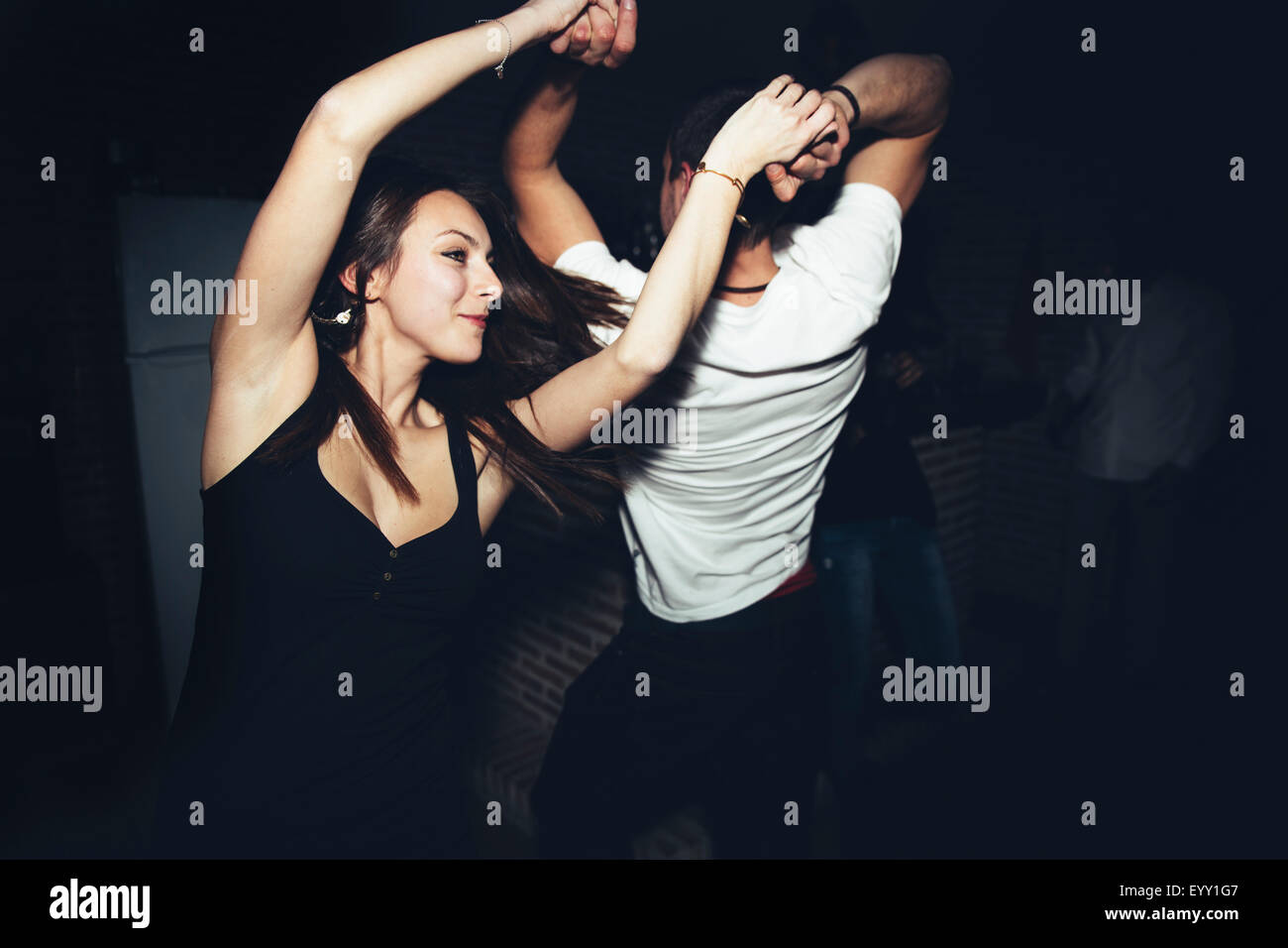 Caucasian couple dancing at the party hi-res stock photography and ...