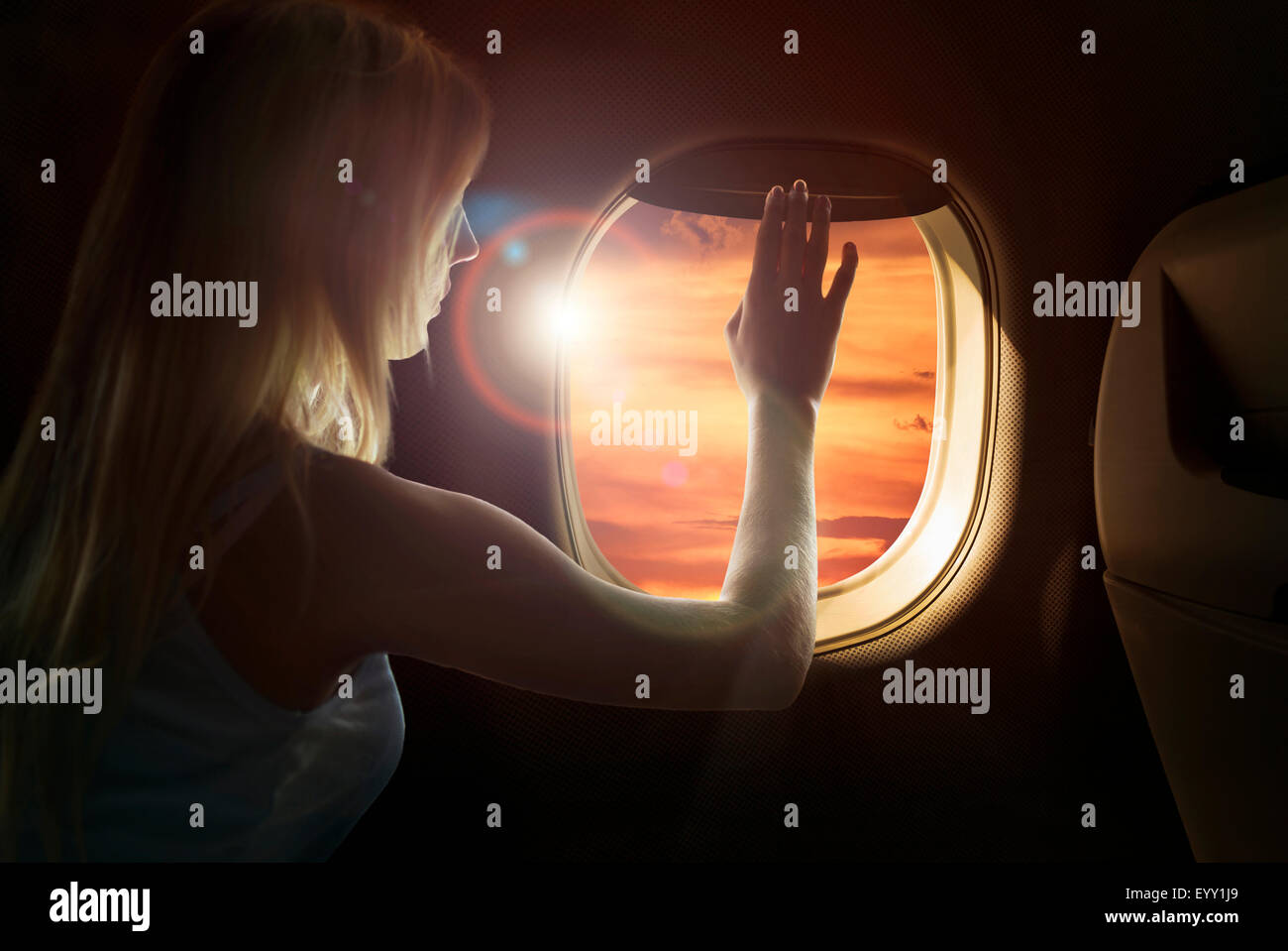 Woman airplane window hi-res stock photography and images - Alamy