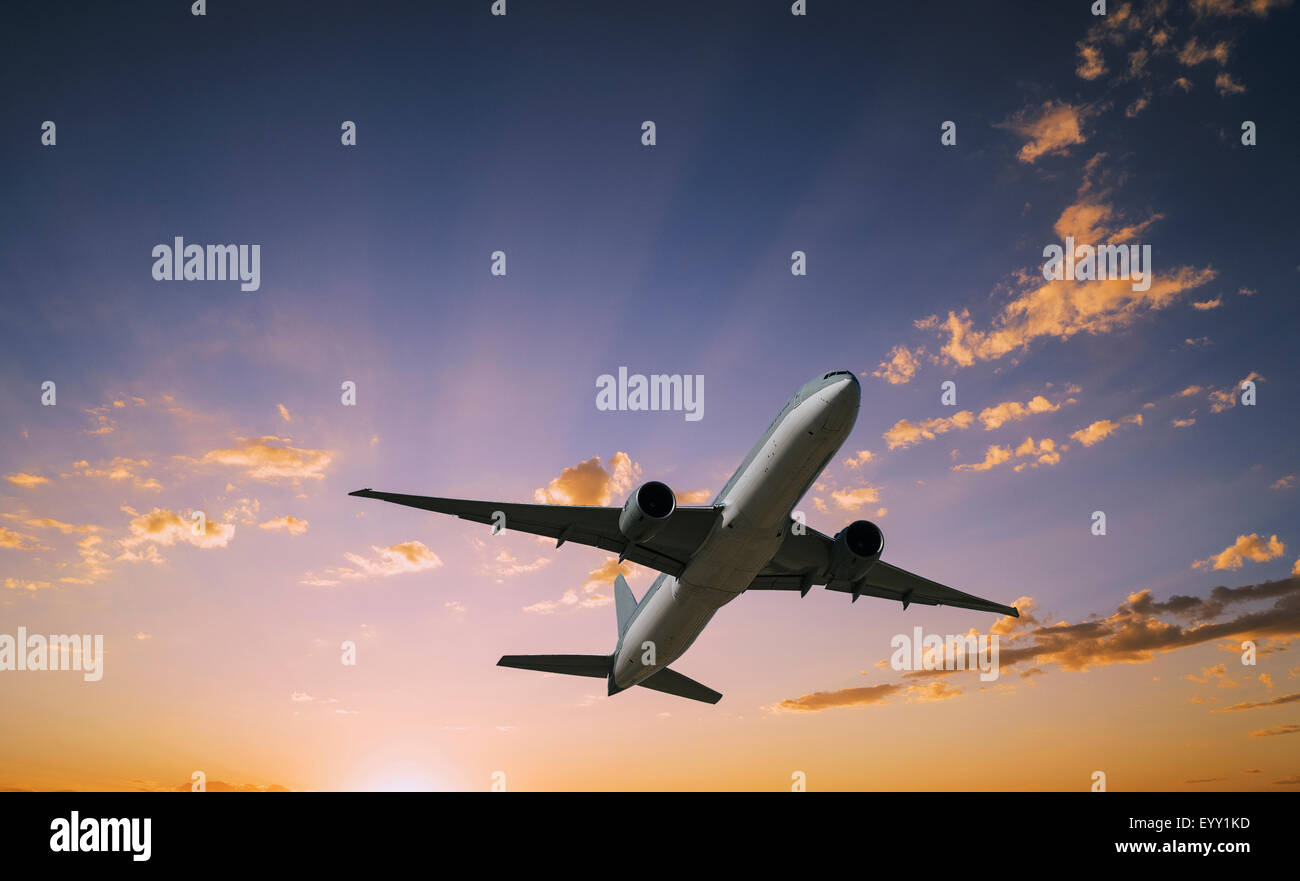 Airplane flying dramatic sunset sky hi-res stock photography and images ...