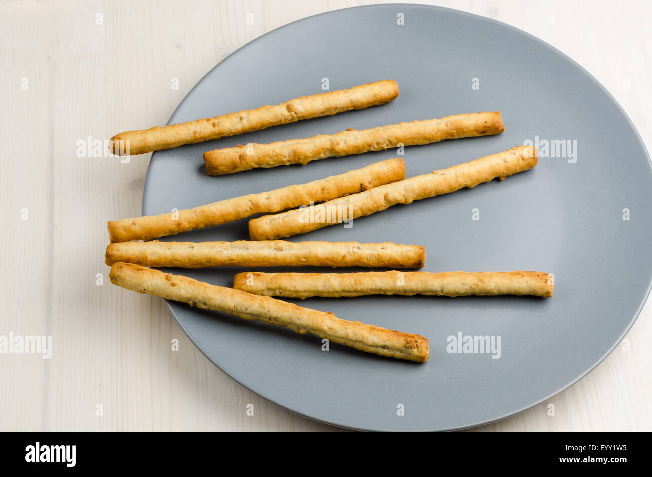 Rustic breadsticks in a dish on wood table hi-res stock photography and ...