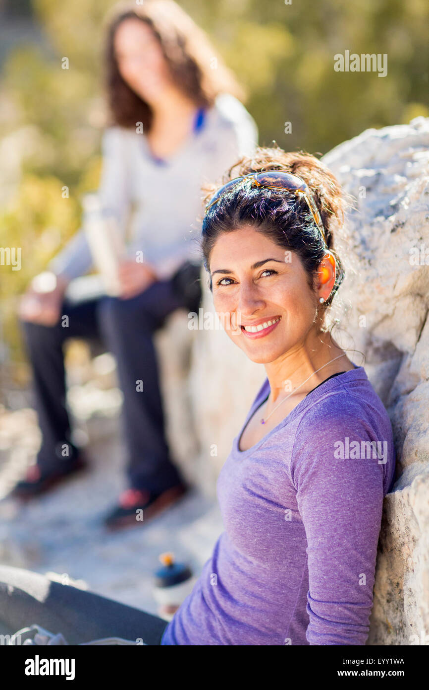 Hiker smiling on rocky hillside Stock Photo - Alamy