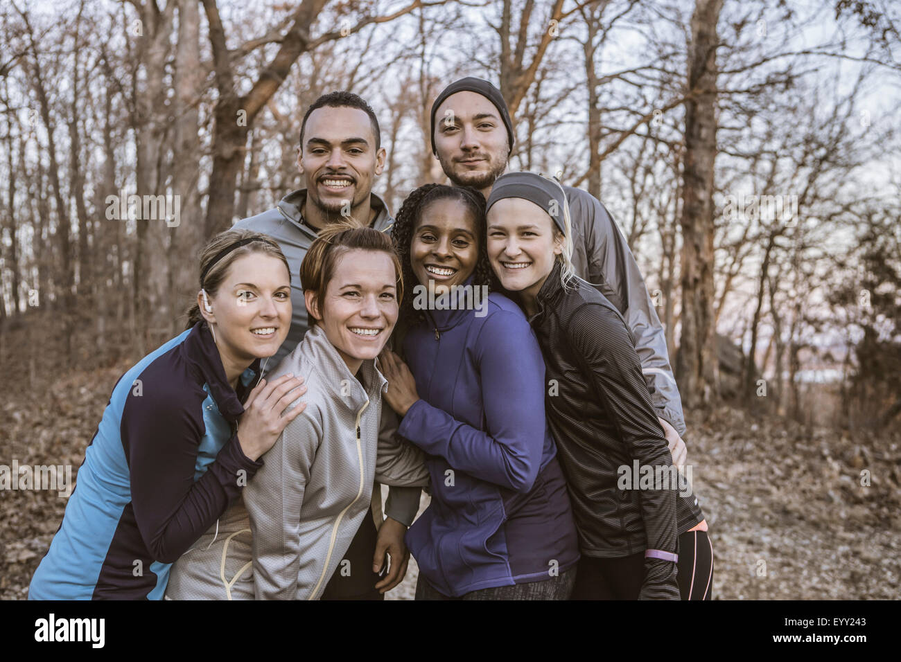 Runners smiling on forest path Stock Photo - Alamy