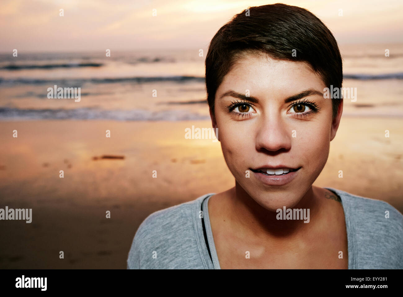 Woman standing by beach hi-res stock photography and images - Alamy