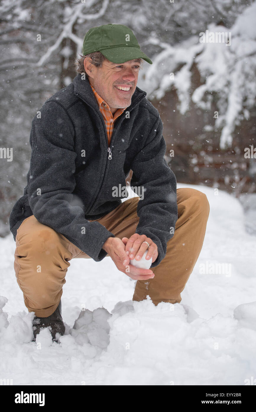 Man making snowball hi-res stock photography and images - Alamy