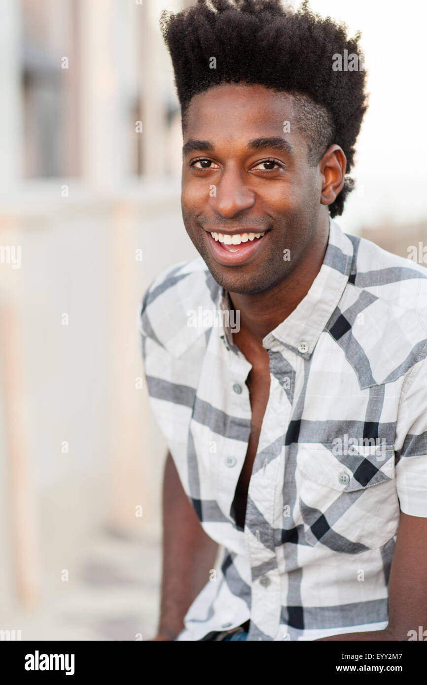 Black man smiling outdoors Stock Photo - Alamy