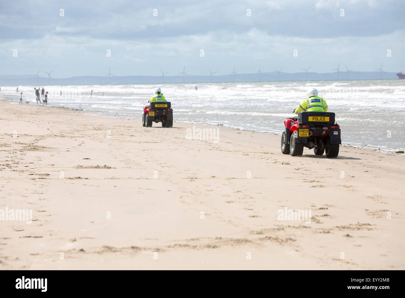 Formby beach near Southport , UK. Police on quad bikes Stock Photo - Alamy