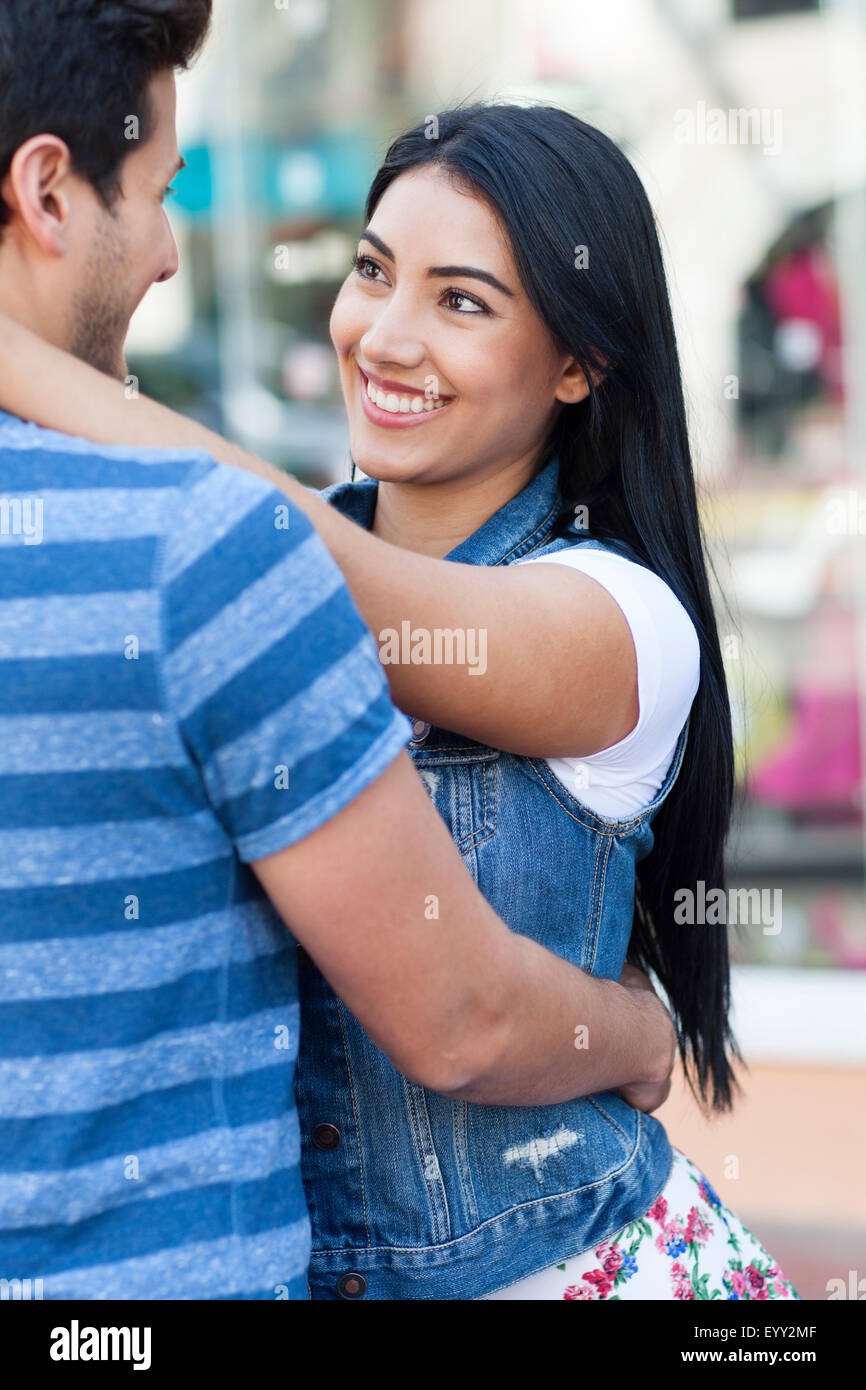 Close up of Hispanic couple hugging Stock Photo - Alamy