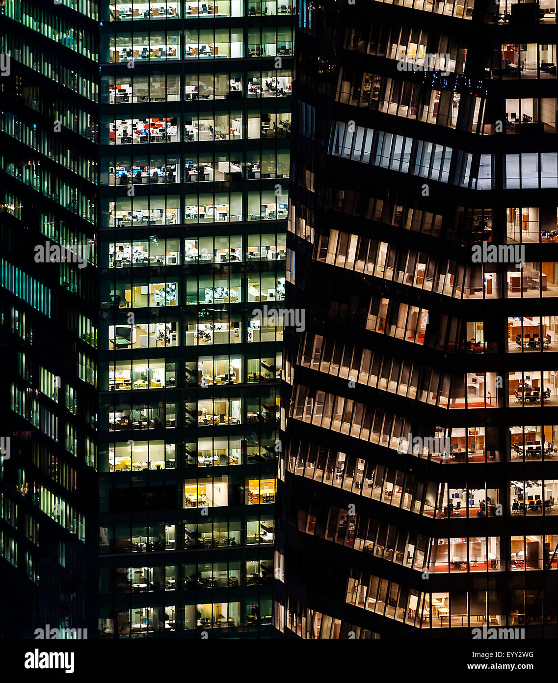 Illuminated highrise buildings at night Stock Photo - Alamy