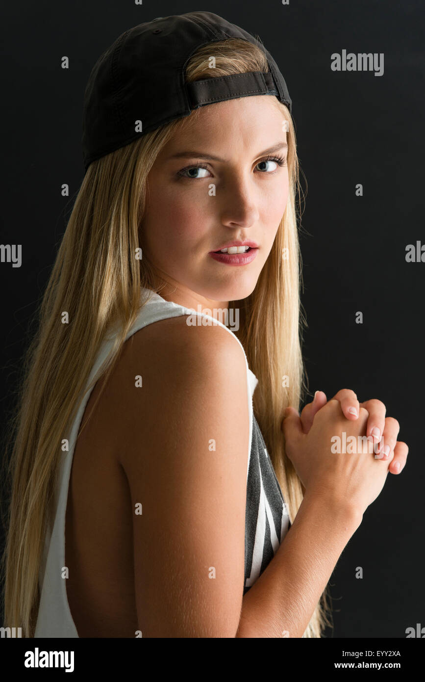 Serious Caucasian woman looking over her shoulder Stock Photo - Alamy