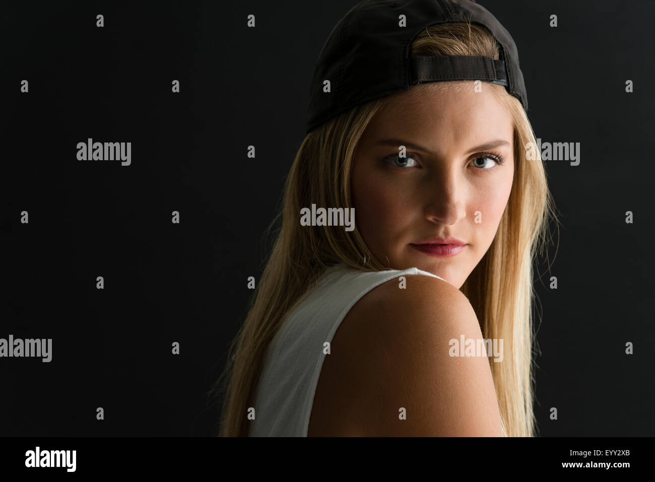 Boy looking over shoulder hi-res stock photography and images - Alamy