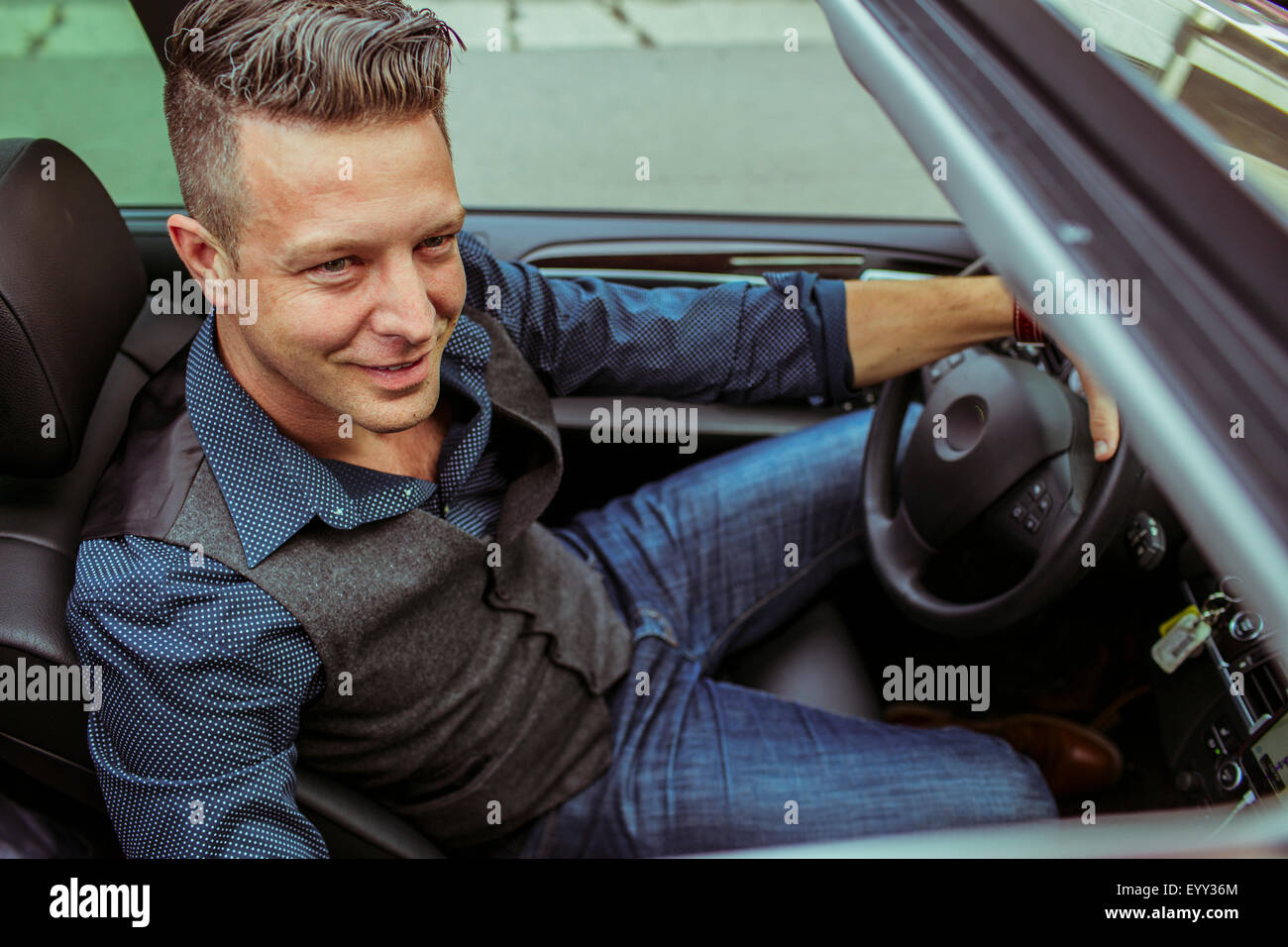 High angle view of Caucasian man driving car Stock Photo - Alamy