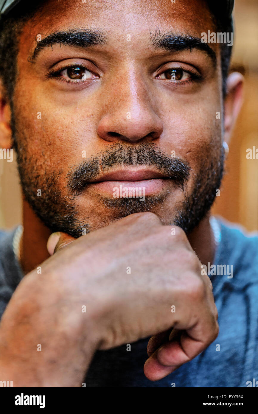 Close up of hand on chin of mixed race man Stock Photo - Alamy