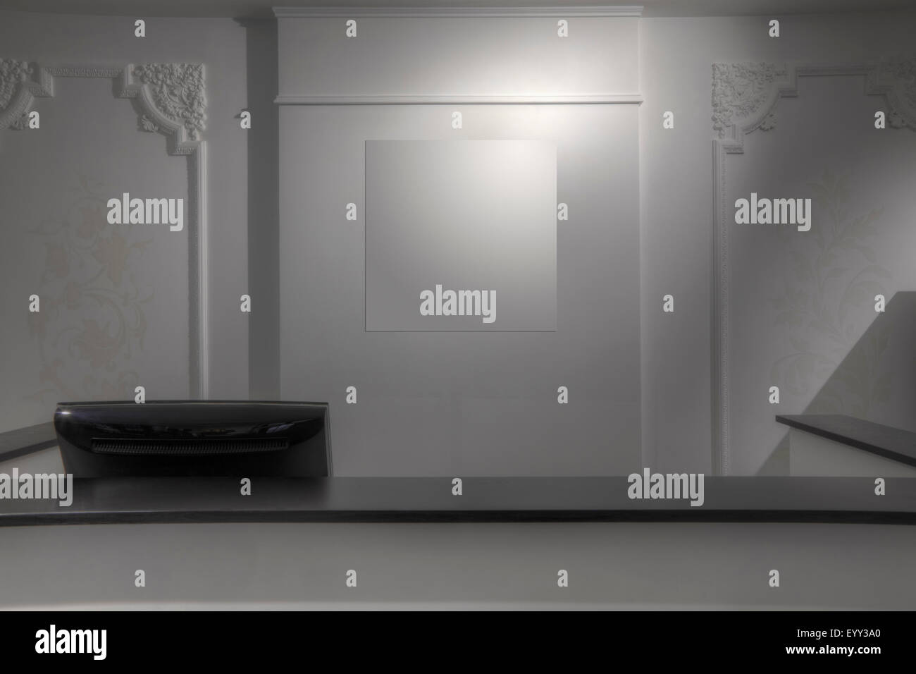 Computer behind empty counter in store Stock Photo - Alamy