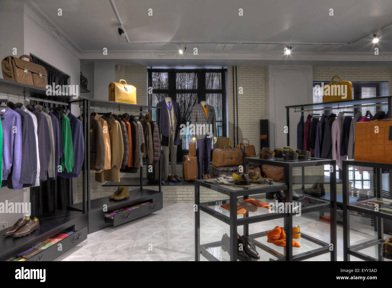 Suits and shoes in clothing store for men Stock Photo - Alamy