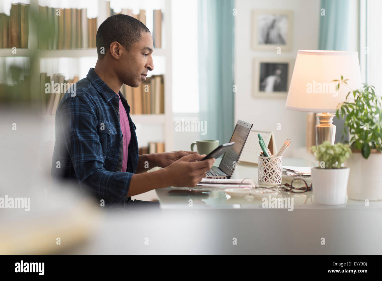 Reading phone at desk hi-res stock photography and images - Alamy