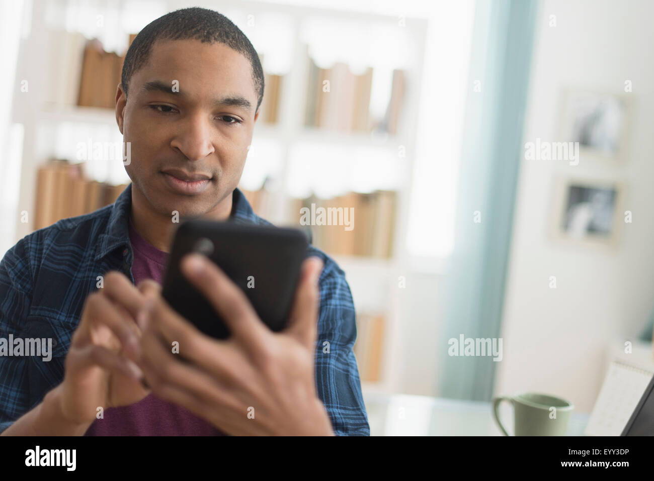 Black man using digital tablet Stock Photo - Alamy
