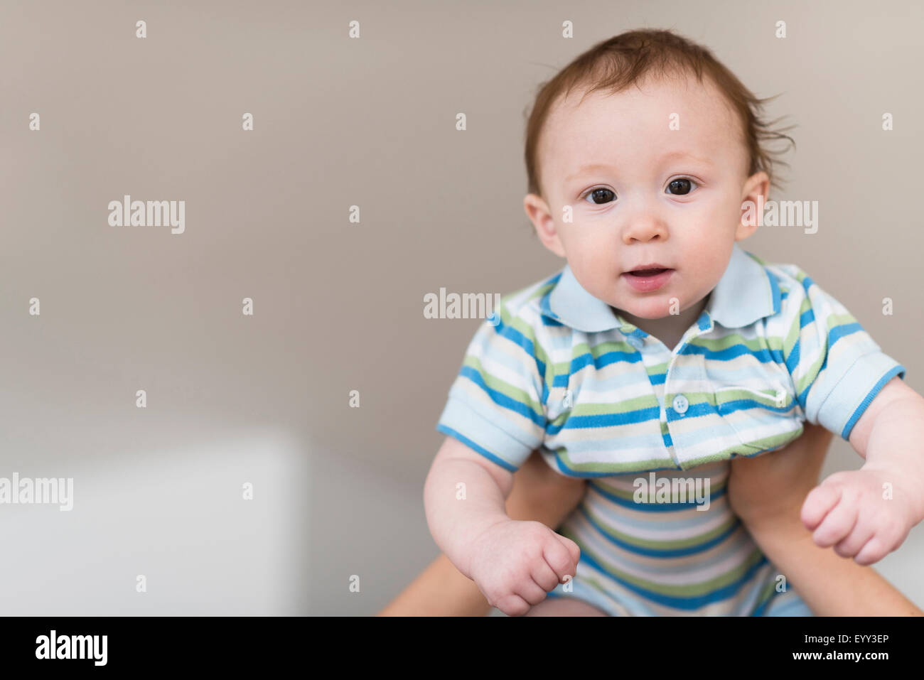 Father lifting up baby hi-res stock photography and images - Alamy